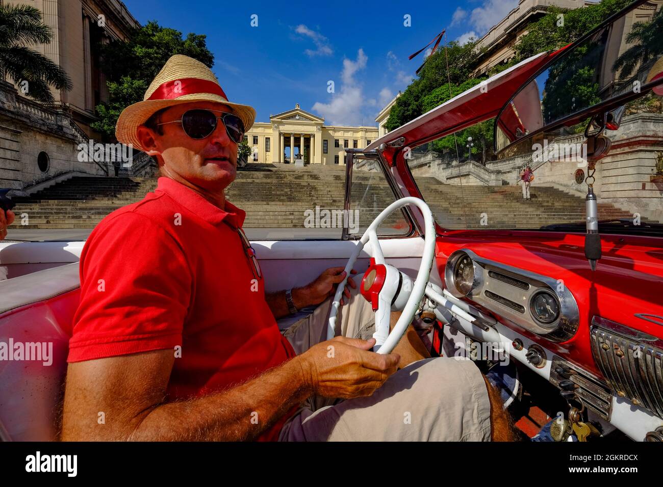 Taxi driver stops in front of the stairs of University of Havana where ...