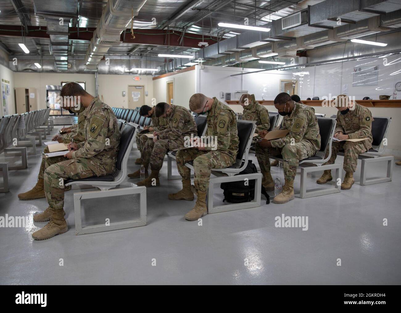 Competitors fill out documents during in-processing for the U.S. Army ...