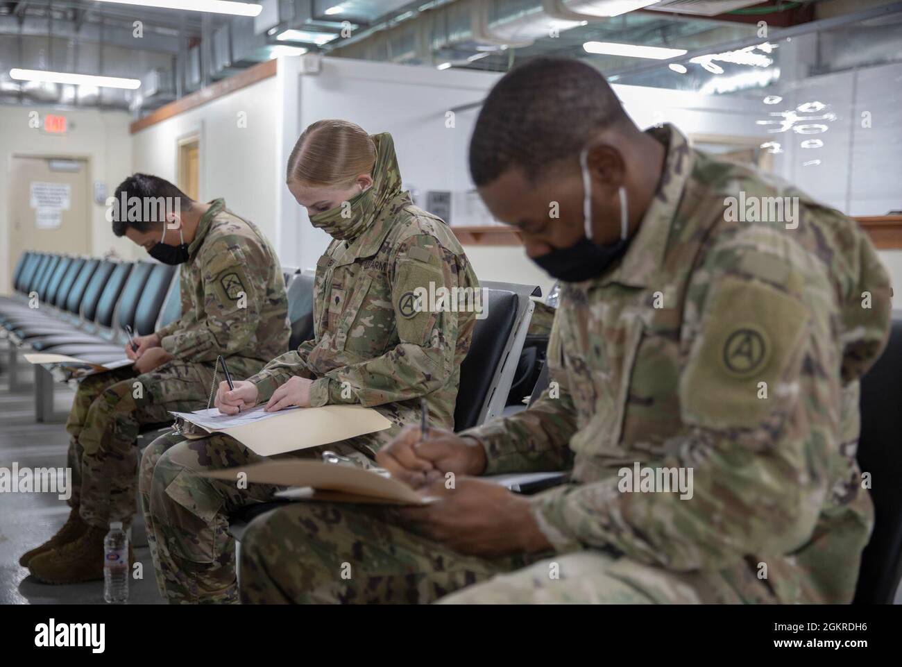 Competitors fill out documents during in-processing for the U.S. Army ...