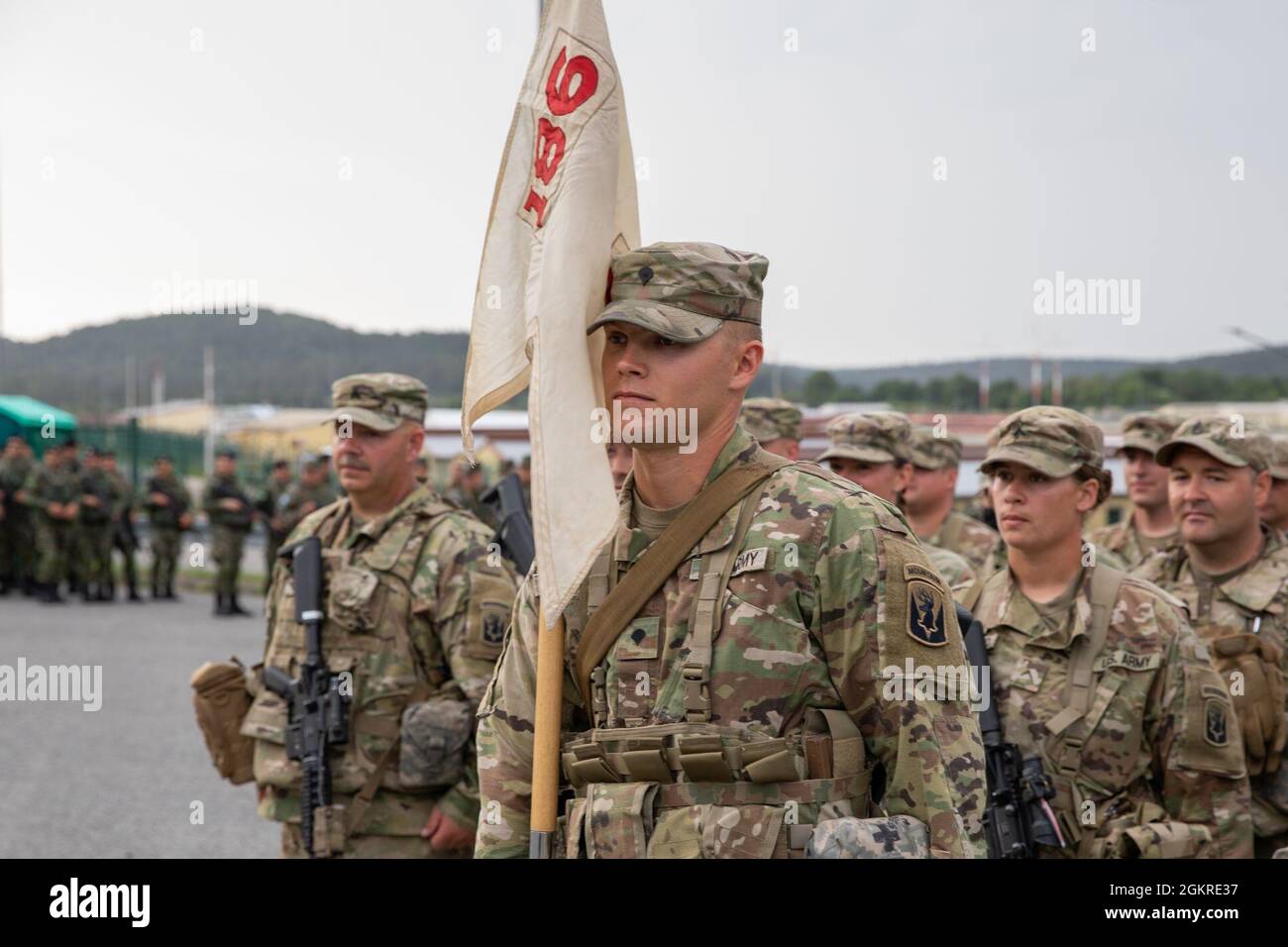 Guidon bearer of the 186th Brigade Support Battalion, 86th Infantry ...