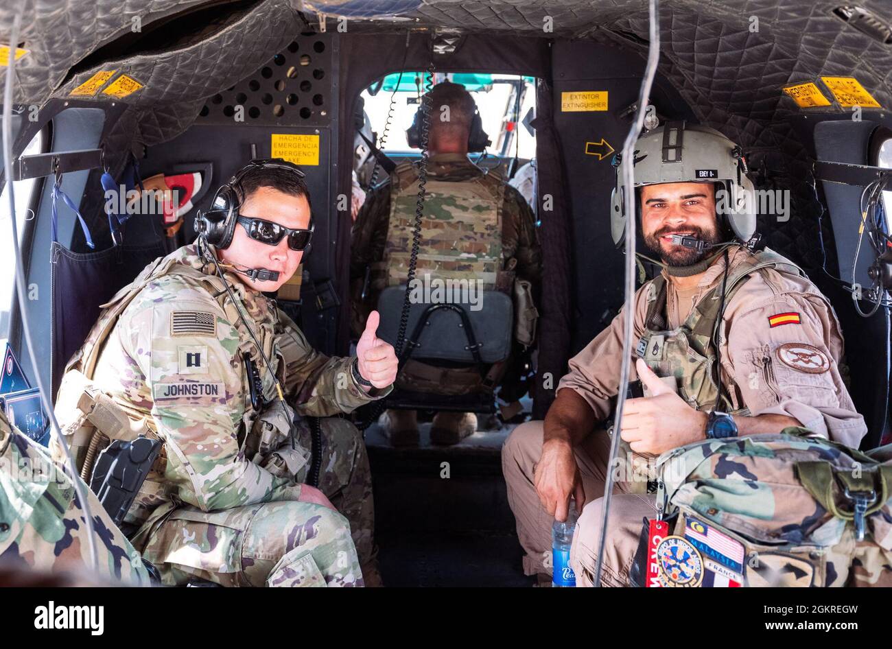 U.S. Soldier Capt. Paul Johnston, left, from Task Force Phoenix, and ...