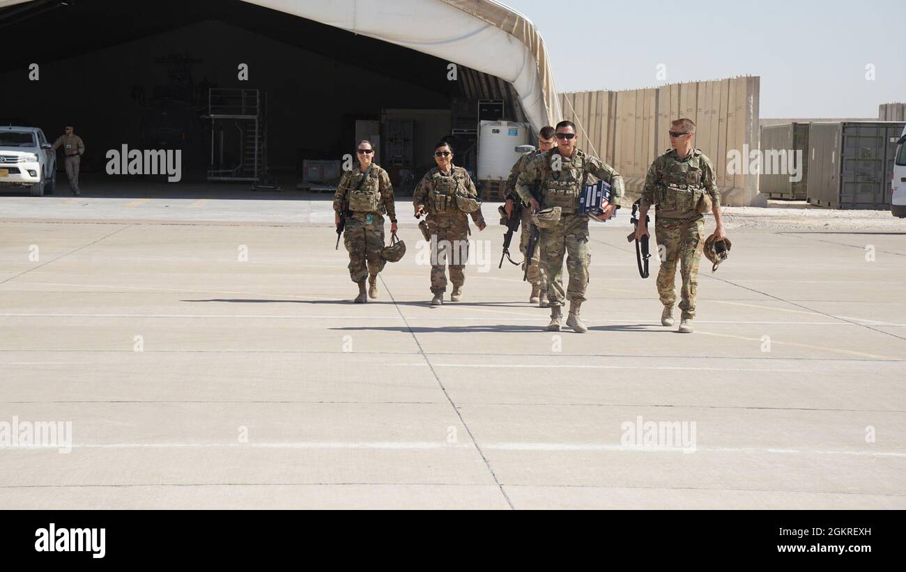Task Force Phoenix Soldiers walk to their aircraft at Al Asad Air Base ...