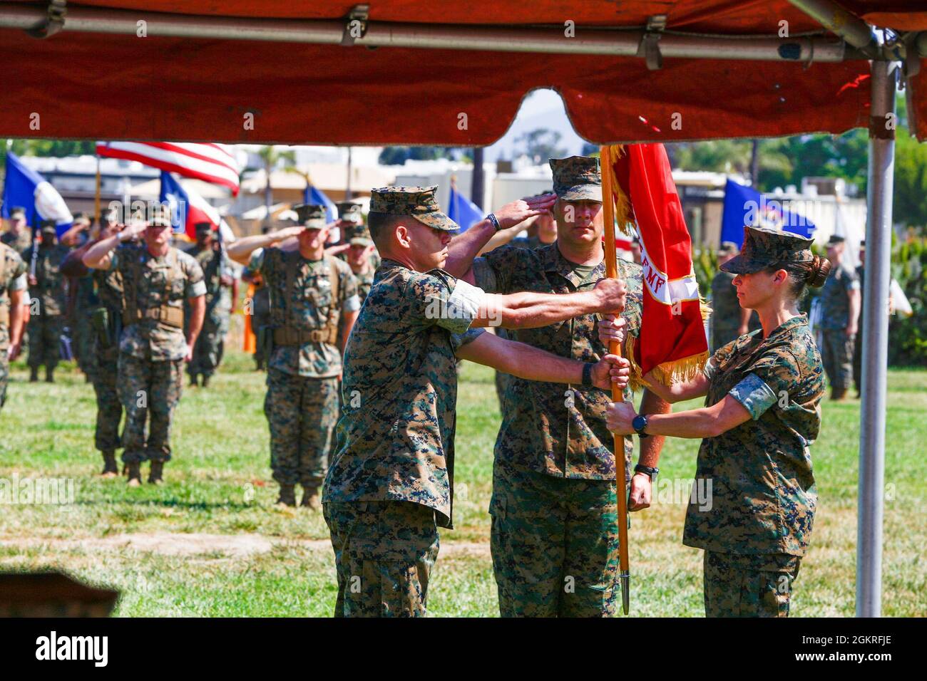 U.S. Marine Lt. Col. Meghan A. Kennerly (right), the outgoing ...