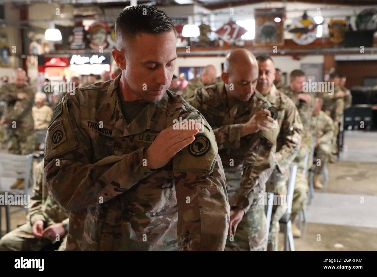 Soldiers from the 67th Maneuver Enhancement Brigade switch their patch ...