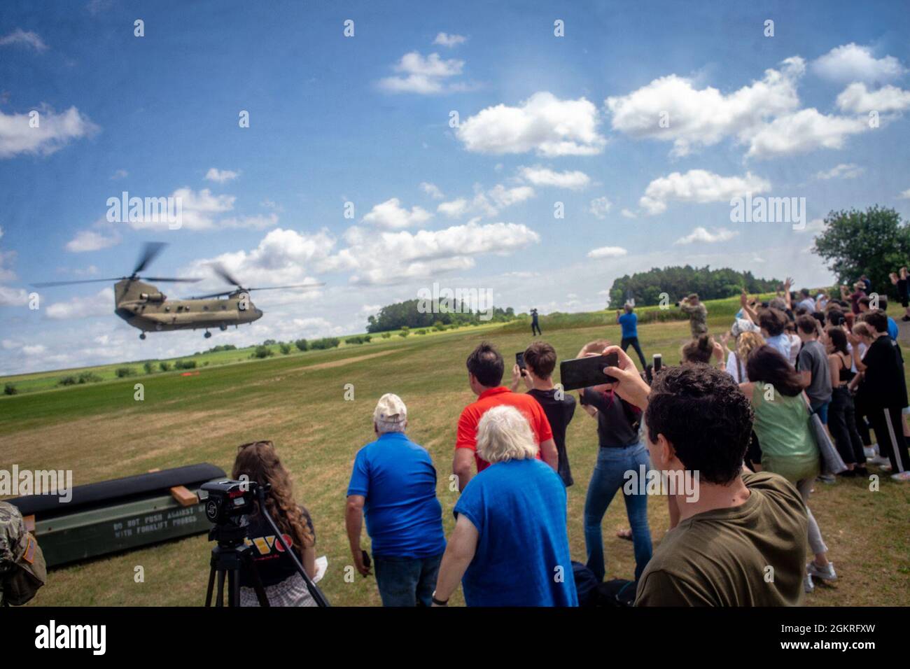 Citizens of Pegnitz, Germany, watch a CH-47 Chinook land after a ...