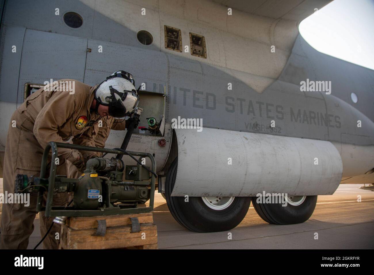 A U.S. Marine with Marine Aerial Refueler Transport Squadron 352 ...