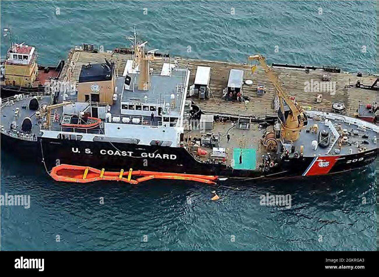 Coast Guard personnel using a Navy current buster system (CBS) near ...