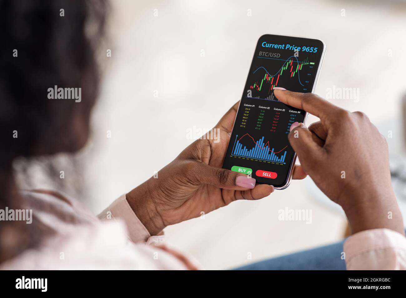 African american woman checking bitcoin price, using mobile app Stock ...