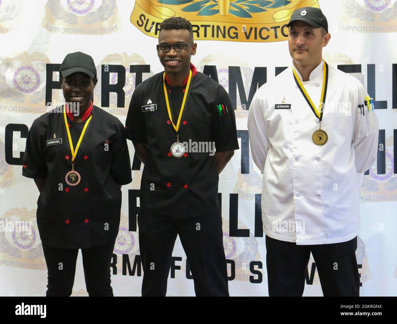 1LT Nickesha Carmichael, SGT Anthony McKoy, and SFC Adam Herrman placed ...