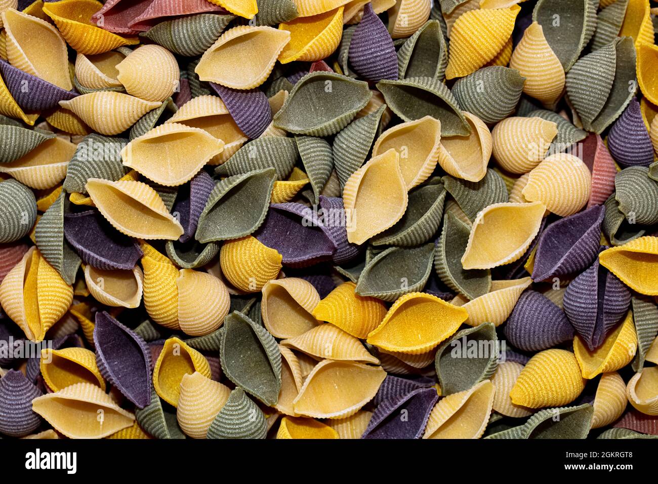 Closeup of colorful conchiglie pasta background Stock Photo - Alamy