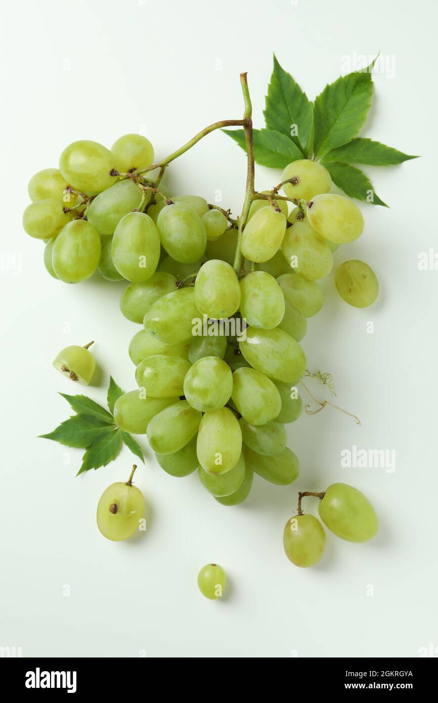 Green ripe grape with leaves on white background Stock Photo - Alamy