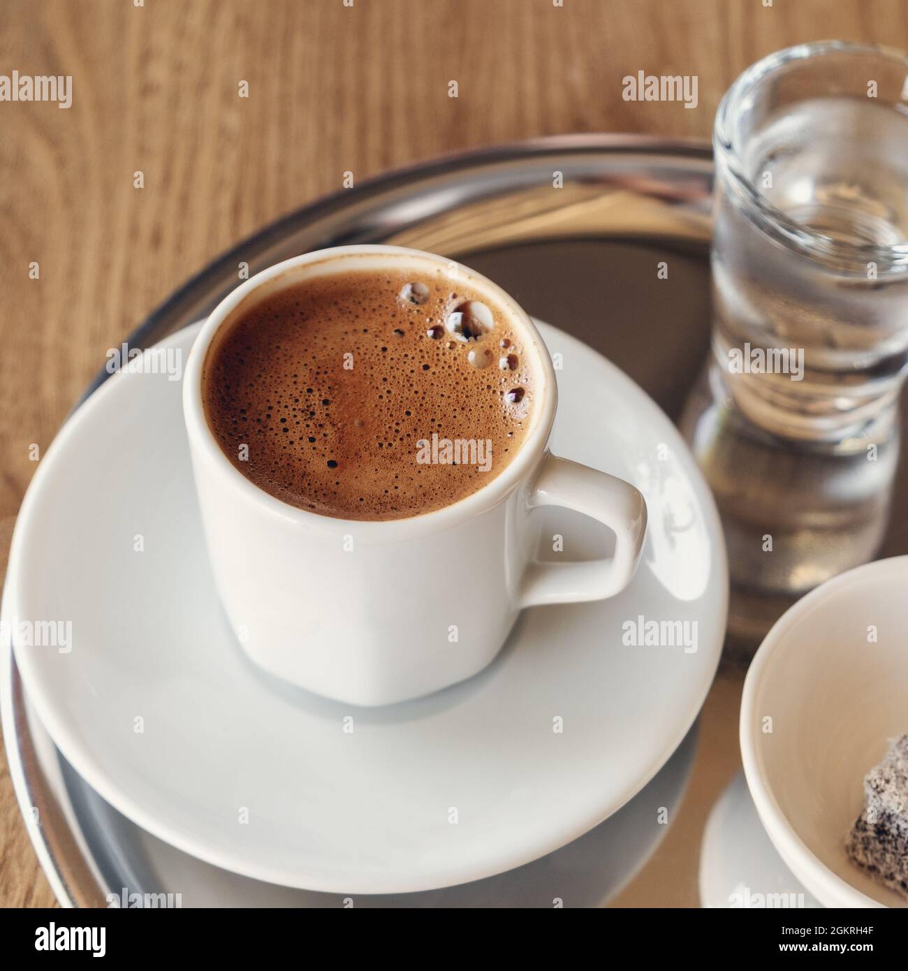 Traditional Turkish coffee with cold water and Turkish delight - Image ...