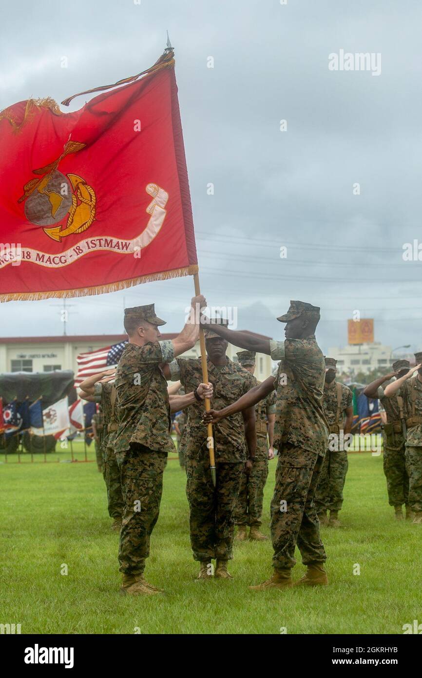 U.S. Marine Corps Lt. Col. Kwabena Gyimah, right, relinquishes colors ...
