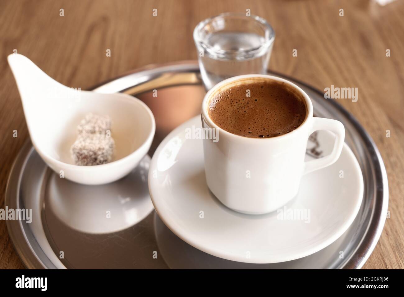 Traditional Turkish coffee with cold water and Turkish delight in cafe ...