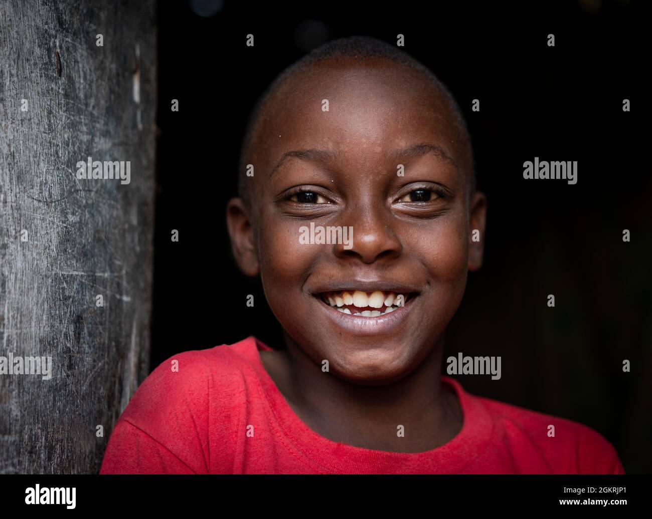 African black boy portrait standing near his poor house alone Stock ...