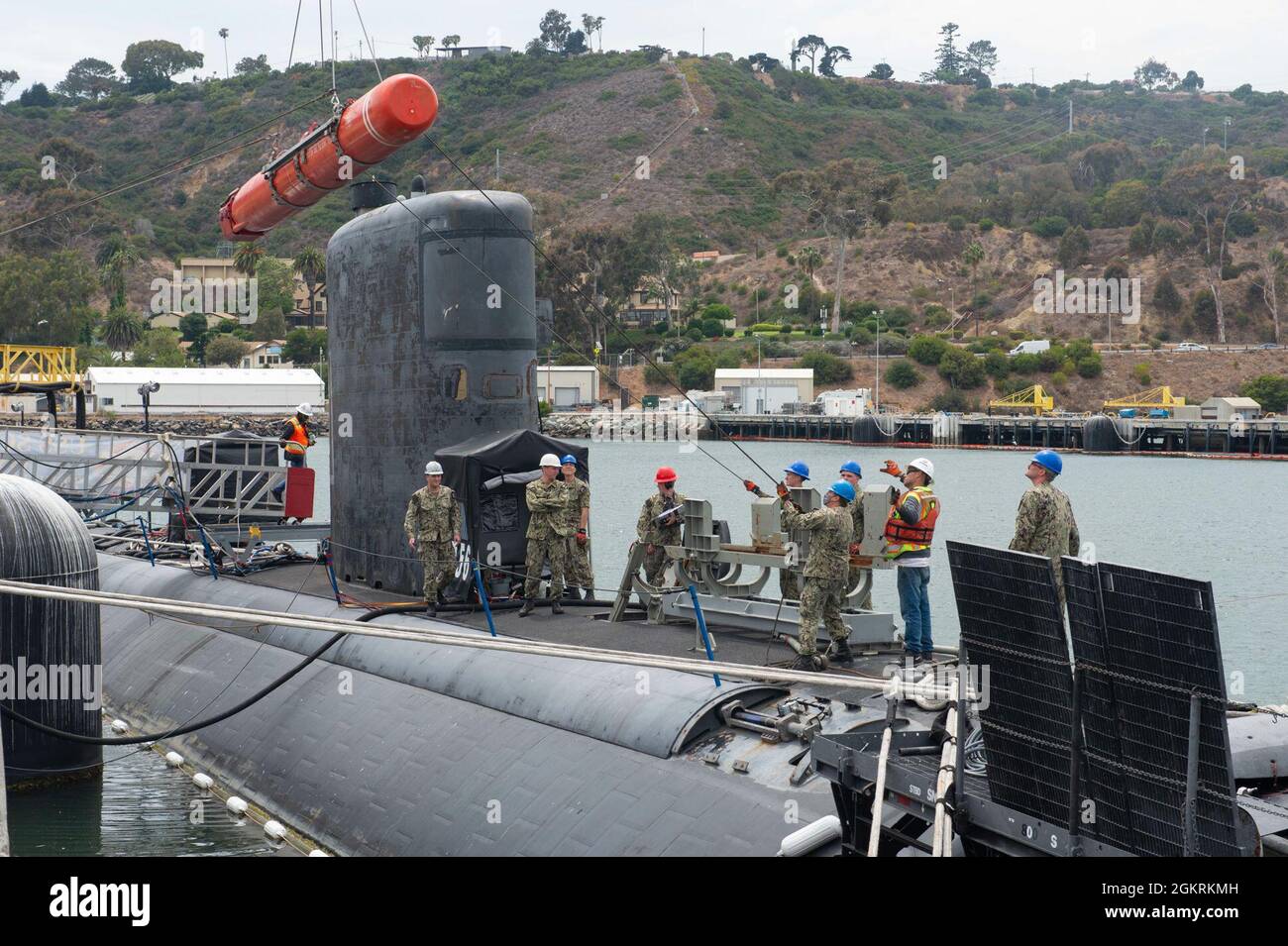 SAN DIEGO (June 22, 2021) Sailors load an inert encapsulated harpoon ...