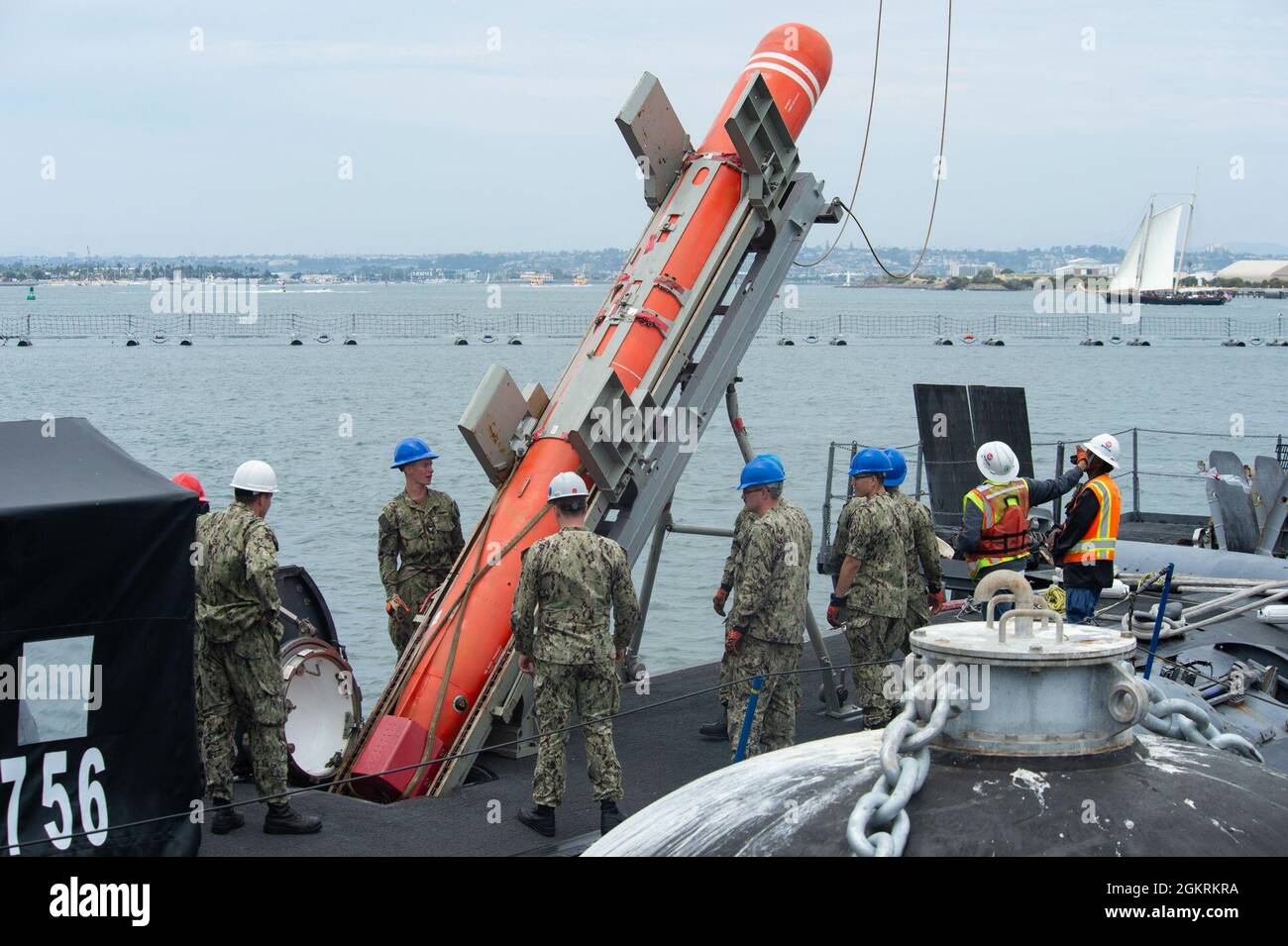 SAN DIEGO (June 22, 2021) Sailors load an inert encapsulated harpoon ...
