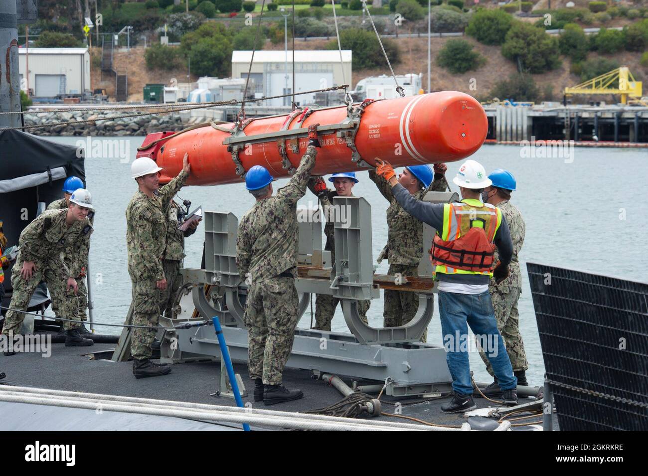 SAN DIEGO (June 22, 2021) Sailors load an inert encapsulated harpoon ...