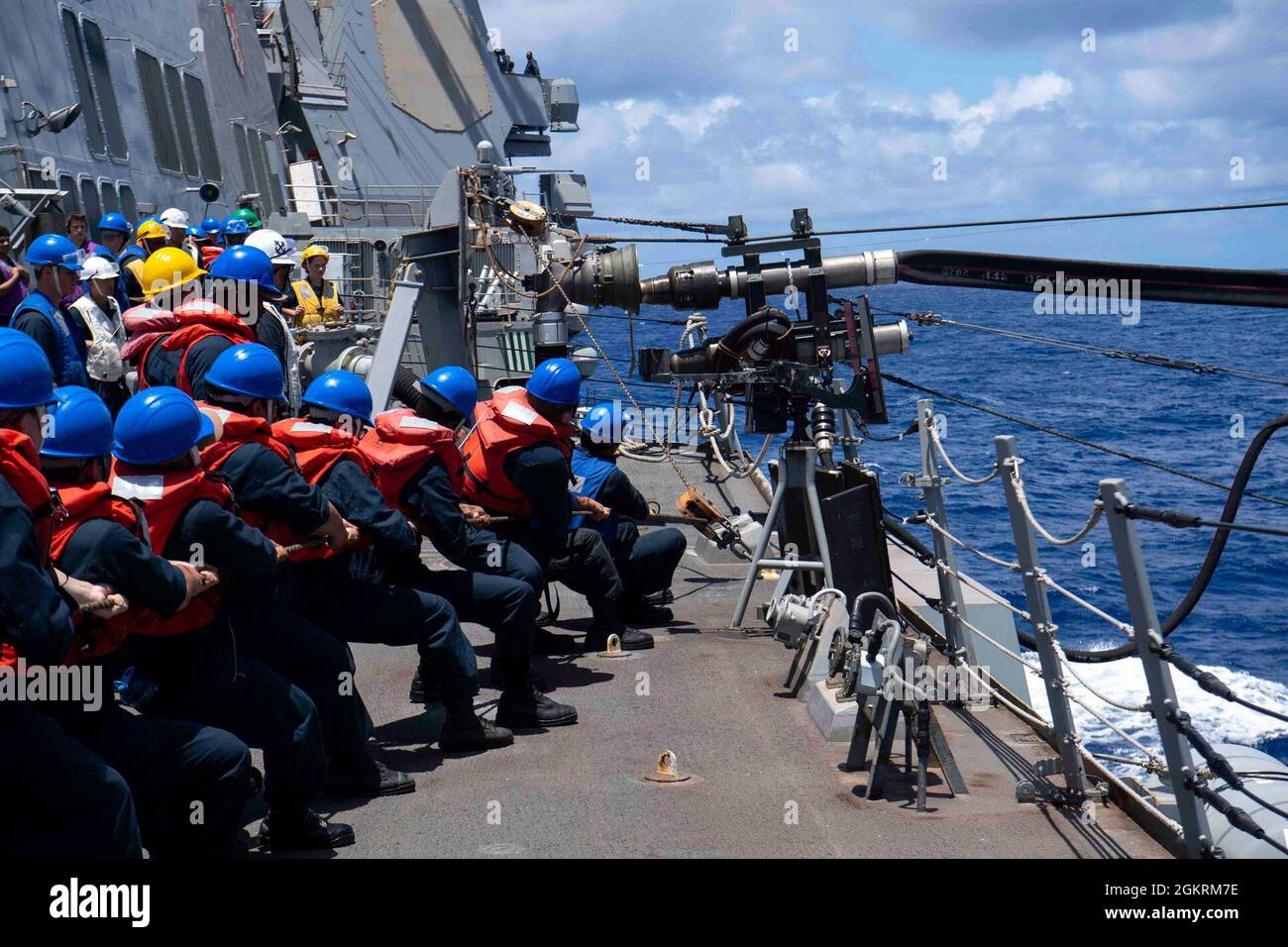 210622-N-CZ893-1177 PACIFIC OCEAN (June 22, 2021) Sailors heave a line ...