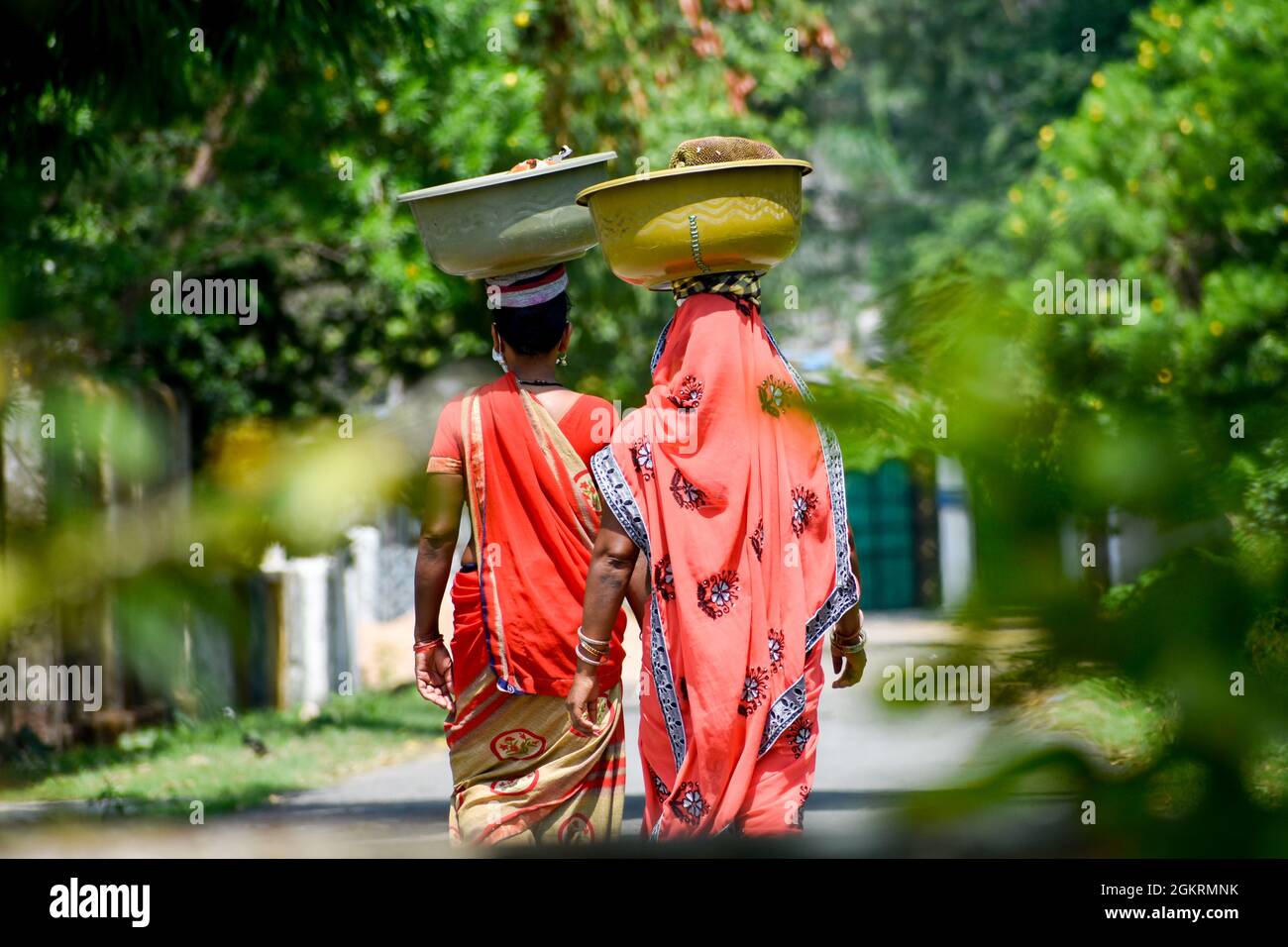 Women carrying an Indian traditional pot full of seeds on her head ...
