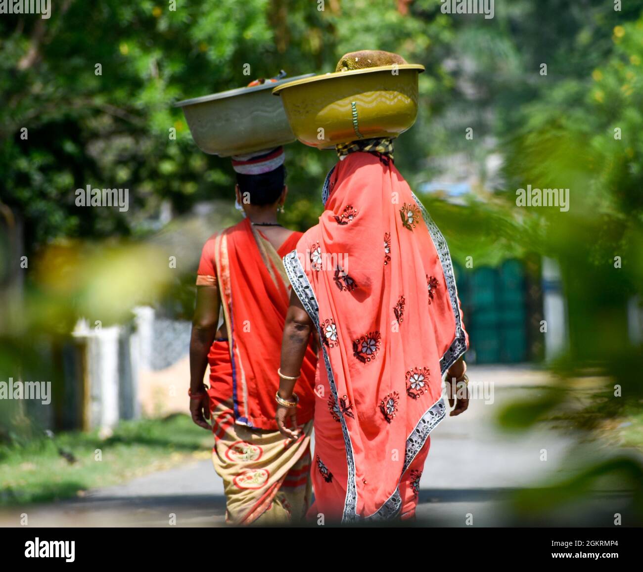 Women carrying an Indian traditional pot full of seeds on her head ...