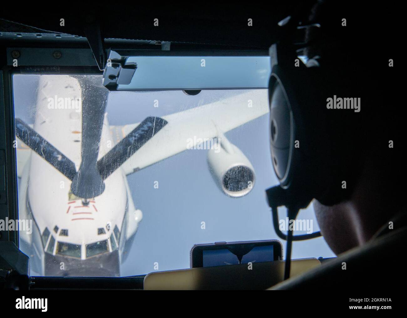 A RC-135V/W Rivet Joint reconnaissance aircraft receives fuel from a U ...