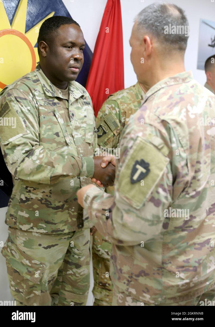 Spc. Adrian Johnson, left, an AH-64 Apache attack helicopter mechanic ...