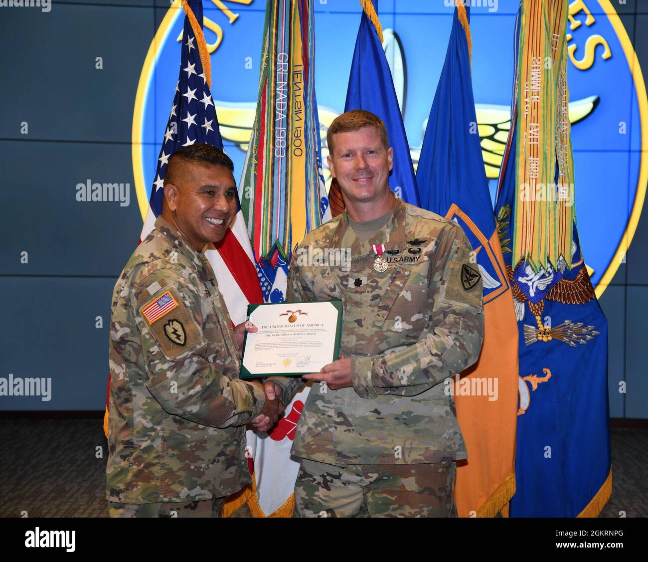 U.S. Army Lt. Col. Keith Hill receives the Meritorious Service Medal ...