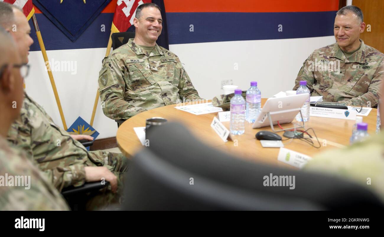 Task Force Phoenix commander Col. Alan Gronewold shares a laugh with ...