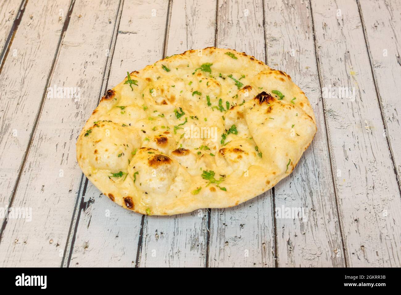 Typical Hindu garlic bread with the name of naan sprinkled with fresh ...