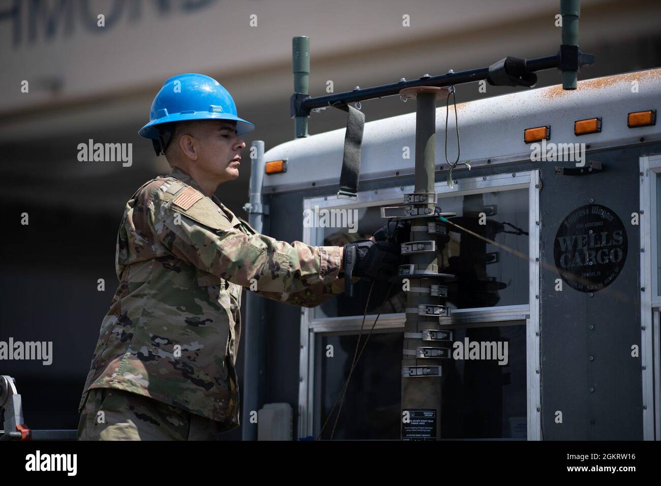 Master Sgt Raul Ramirez prepares communication equipment for use during ...
