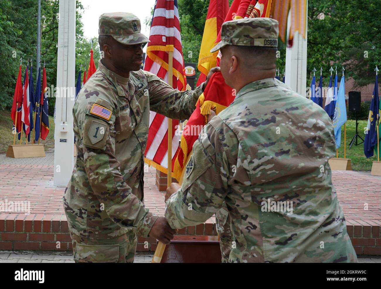 Command Sgt. Maj. Charles L. Robinson III accepts the unit guidon from ...