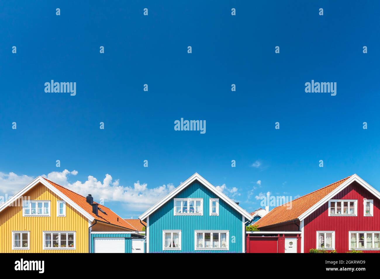 Colorful old swedish houses in front of a blue sky Stock Photo - Alamy