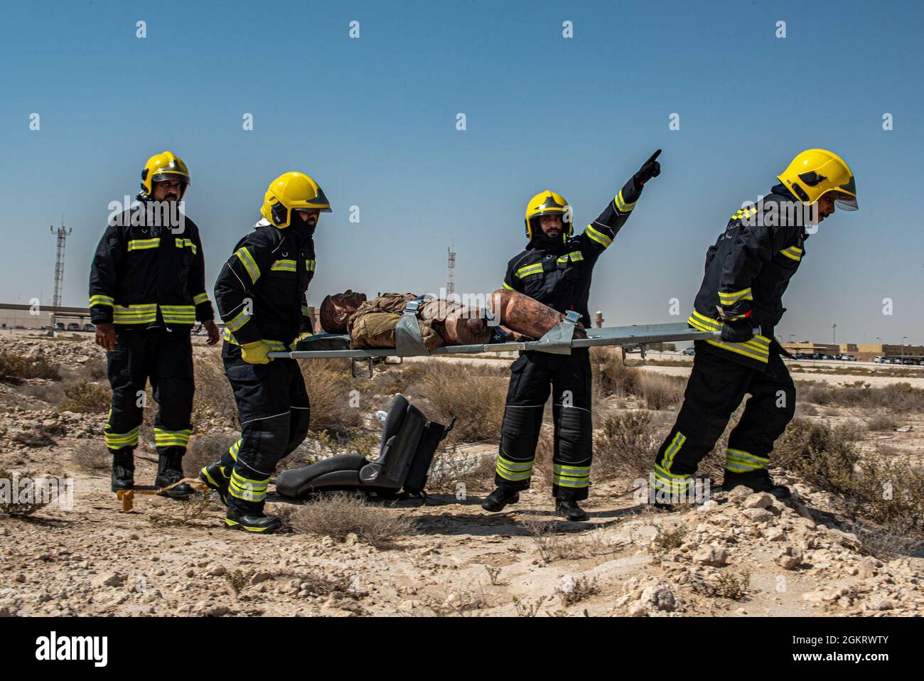 Qatar Emiri Air Force Firefighters lift a patient with simulated ...