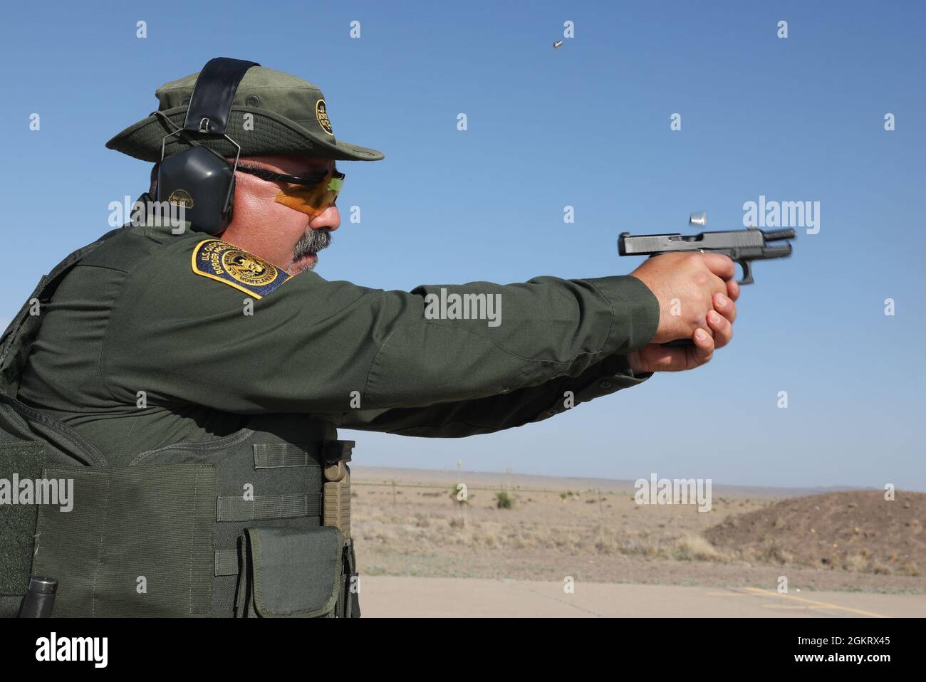 Expended brass flies from a Glock 47 pistol as a Border Patrol agent ...