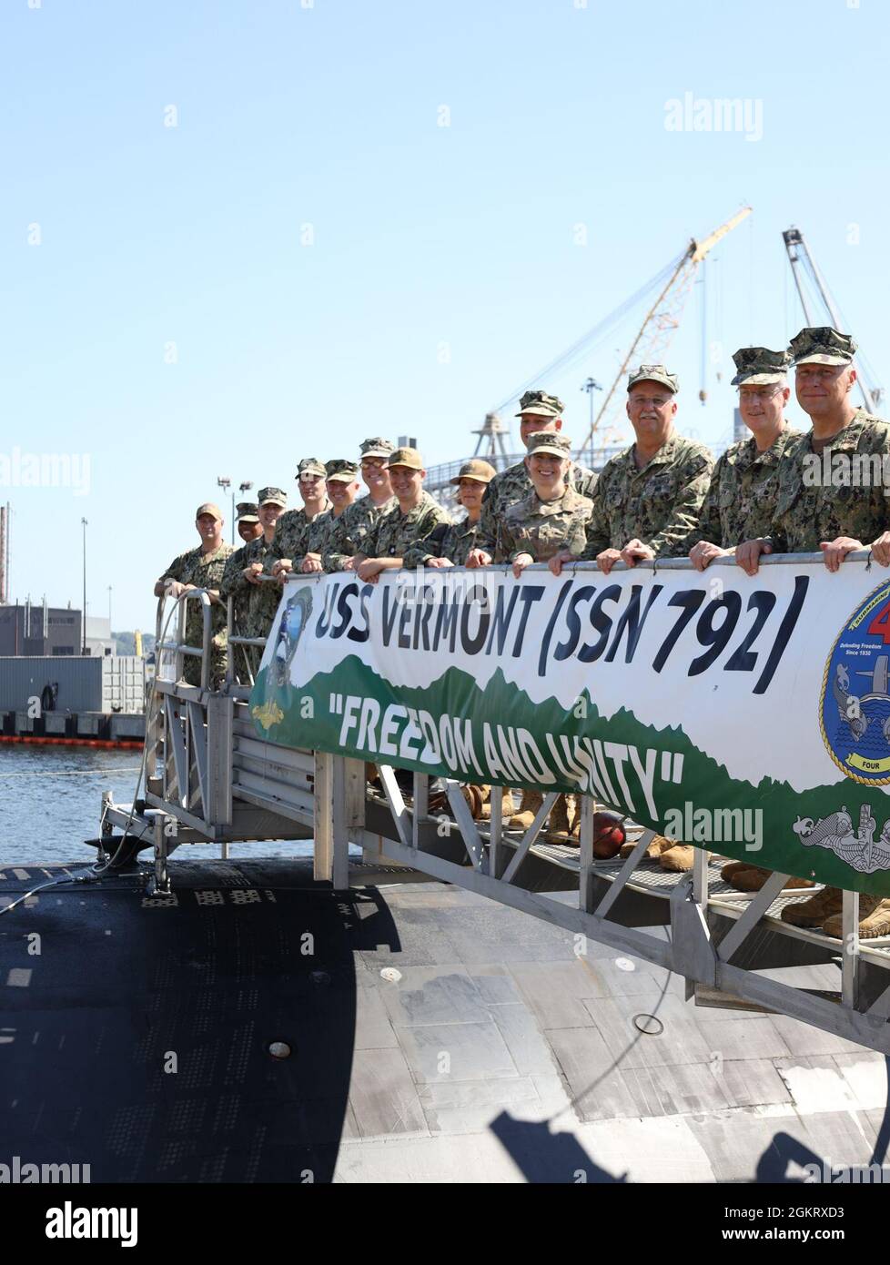 Crew members assigned to the Virginia-class fast-attack submarine USS ...