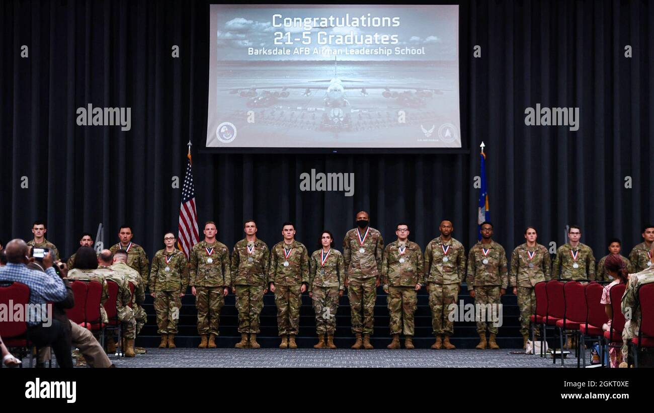 Airmen from Airman Leadership School Class 21-5 stand at the position ...
