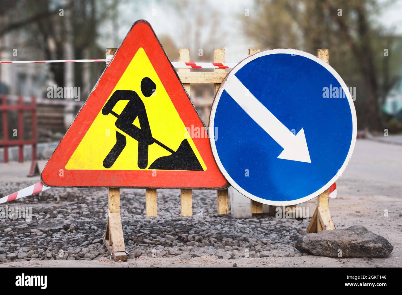 Warning sign of repair work, prescriptive sign indicating the side of ...