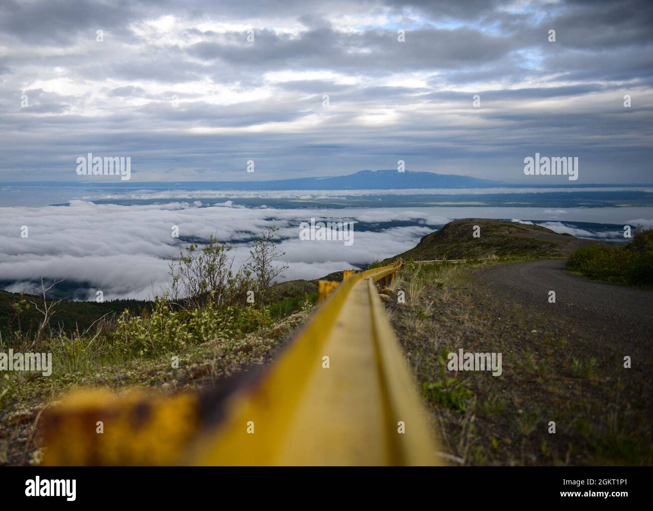 Mount Susitna and the Anchorage bowl is seen through the clouds from ...