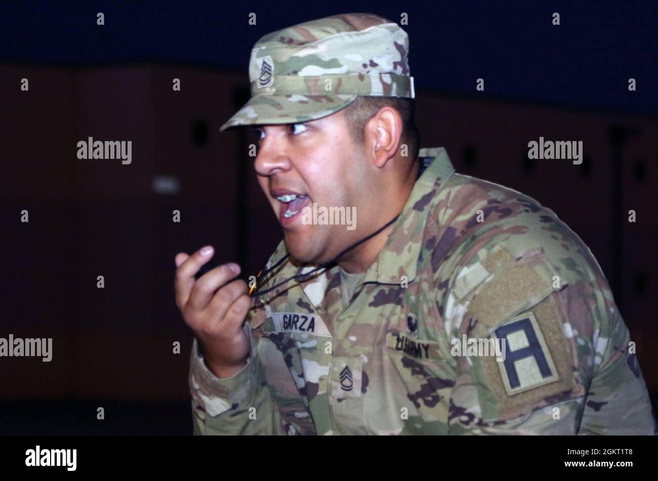Sgt. 1st Class Matthew Garza, an observer, coach/ trainer assigned to ...