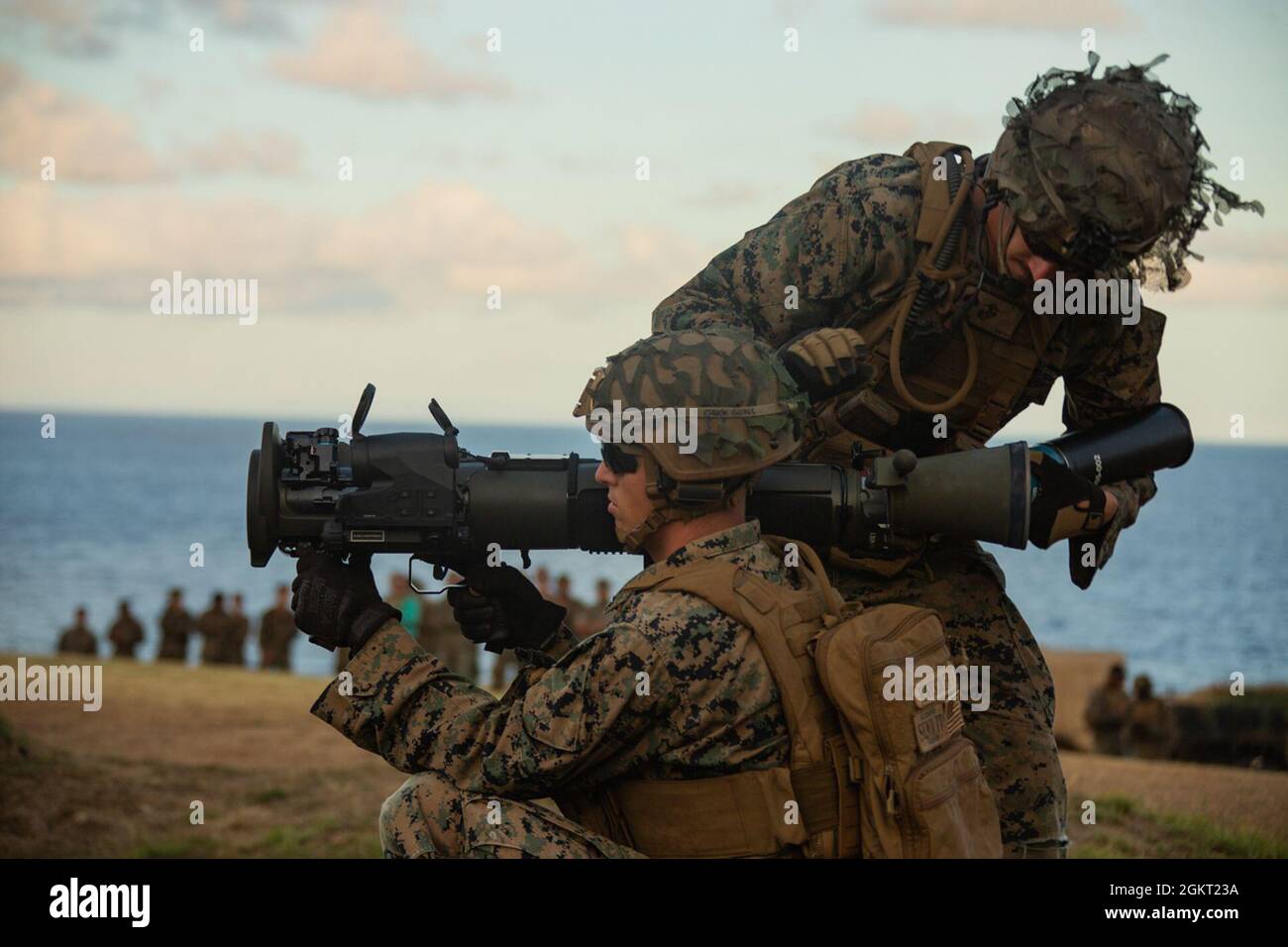 U.S. Marine Corps Lance Cpl. Nolan Rentschler (left), a machine gunner ...