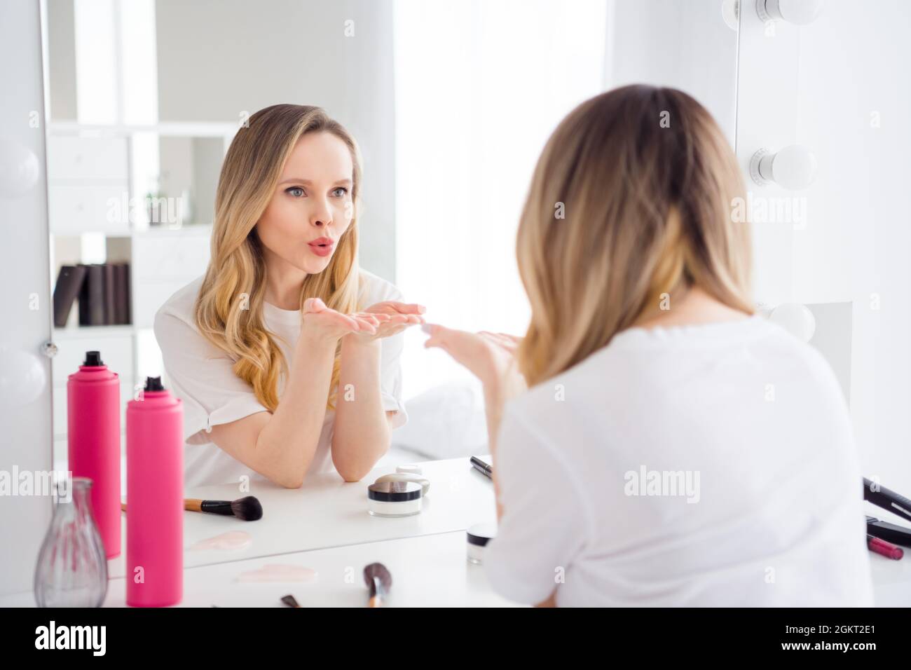 Portrait Of Attractive Affectionate Girl Looking At Mirror Sending Air