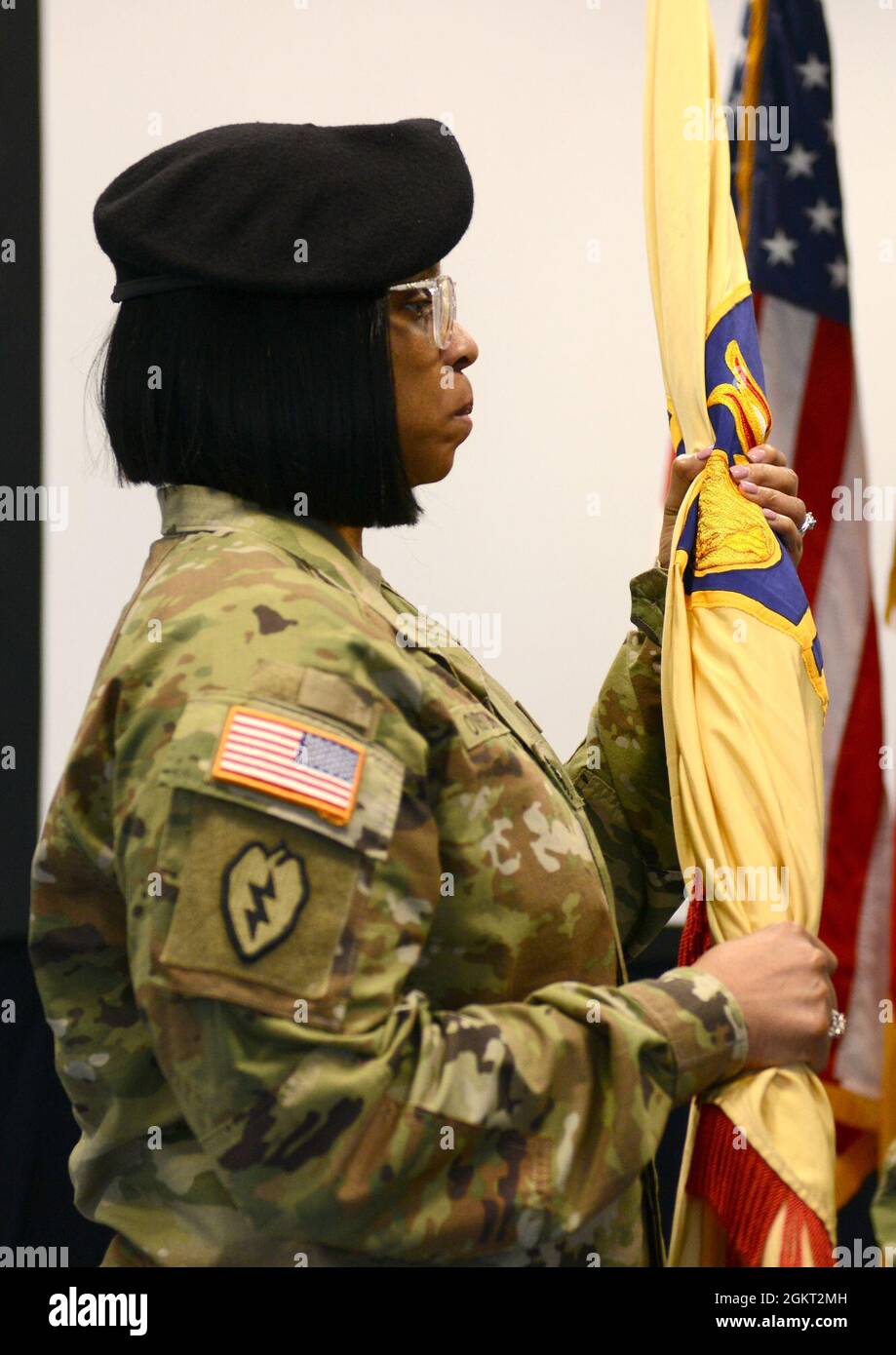 U.S. Army Command Sgt. Maj. Della S. Overton with the 409th Contracting Support Brigade holds ...
