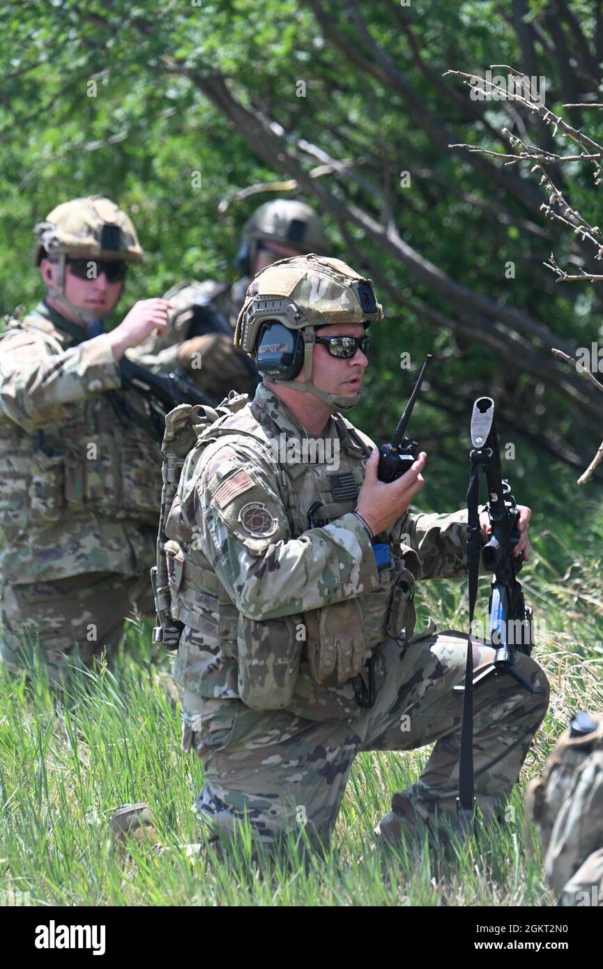 U.S. Air Force Tech. Sgt. Nicholas Van Pelt talks on a radio as he ...
