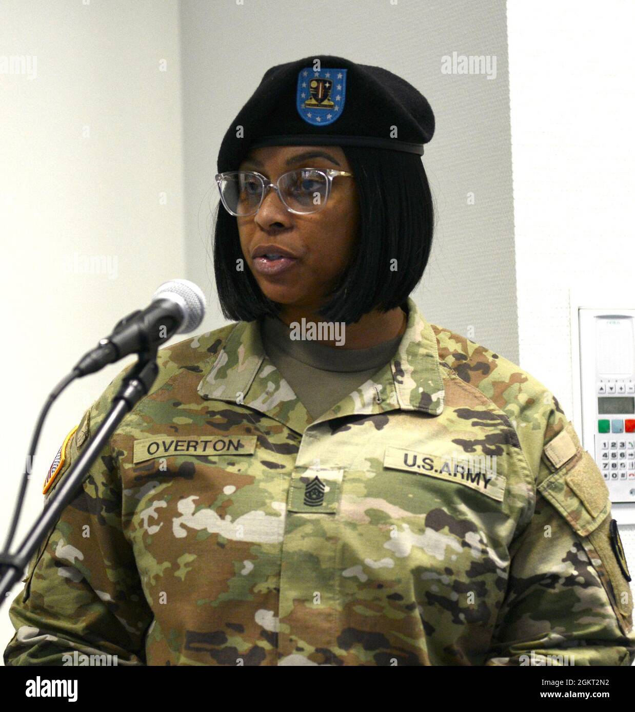 U.S. Army 409th Contracting Support Brigade Command Sgt. Maj. Della S. Overton delivers her ...