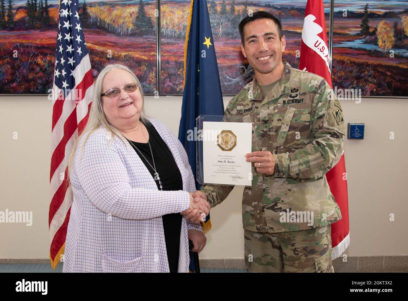 Amy Burke, workforce management specialist, receives a 50-year Army ...