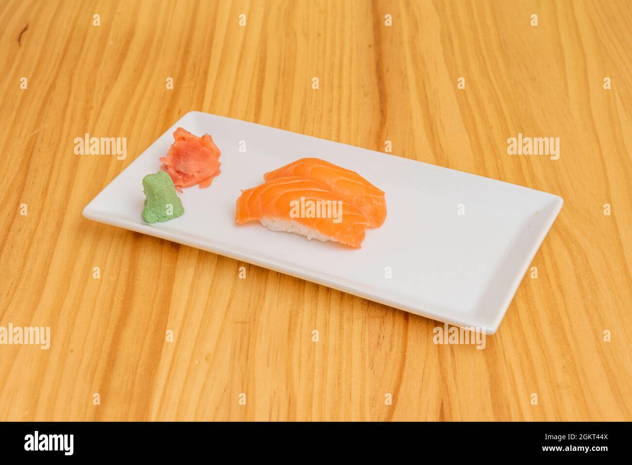 Norwegian salmon nigiri on rice with Japanese vinegar, spicy wasabi and ...