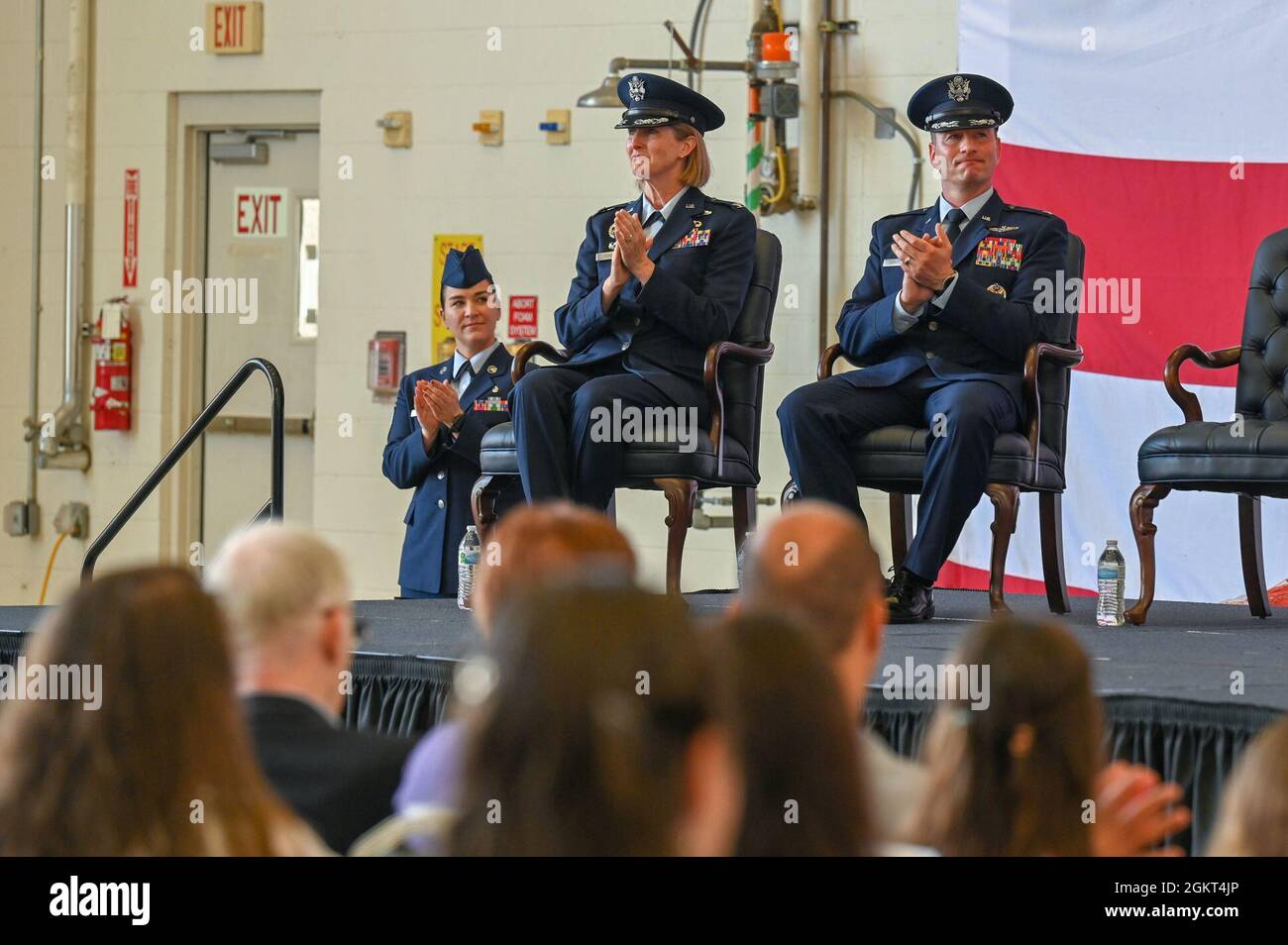 Col. John Schutte, and Col. Angela Ochoa, sit on stage during the 19th ...
