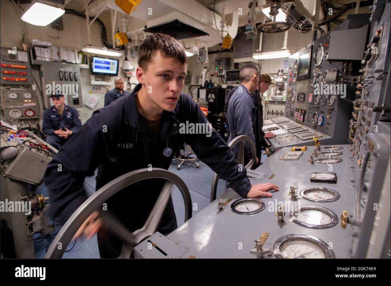 Fireman Micah Allen turns a handwheel during an engineering training ...