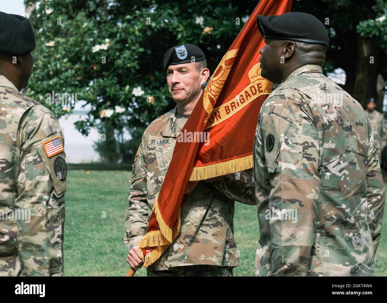 Col. Jeremy St. Laurent, commander, 597th Transportation Bde., holds ...